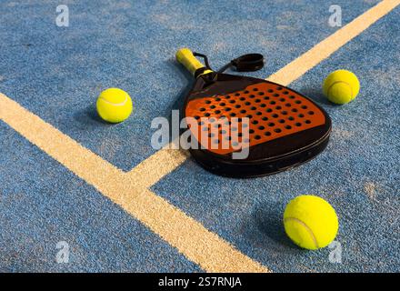 padel racket and yellow balls placed on court near net Stock Photo - Alamy