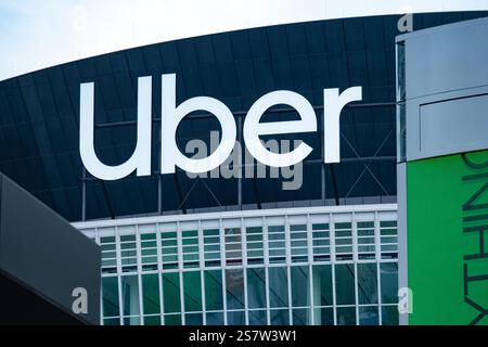 Uber logo on glass facade of modern office building, San Francisco ...