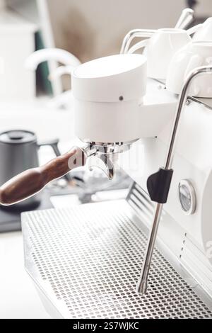 Modern coffee machine on table in kitchen Stock Photo - Alamy