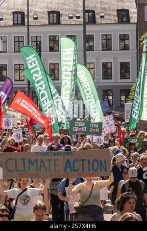 Protesters hold placards during the ’Folkets Klimamarch. The People's ...