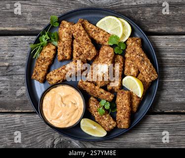 pretzel crusted alaskan pollock fish sticks with lemon slices and ...
