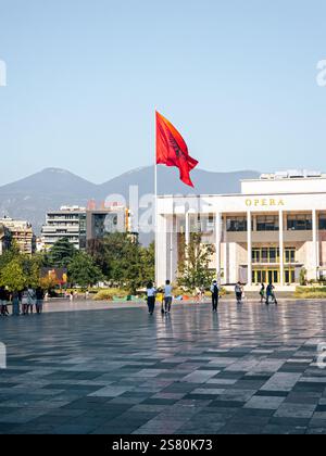 Albanian flag on blue sky Stock Photo - Alamy