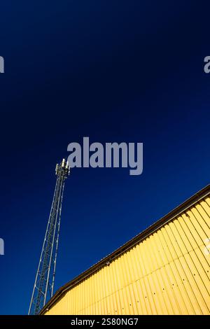 A tall mast with devices for transmitting television and mobile ...