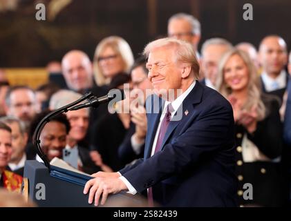 President Donald Trump reacts after signing a trade agreement with ...