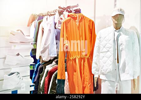 People shop for clothes at an industrial exhibition in Hyderabad, India ...
