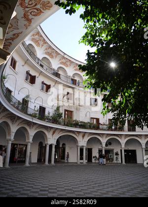 Curved historic house with arcades in Plaza del Cabildo in Seville ...
