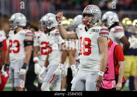 Ohio State quarterback Will Howard smiles as he warms up at the NFL ...