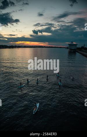 Breakwater near a beach by the seaside at sunset on a clear and sunny ...