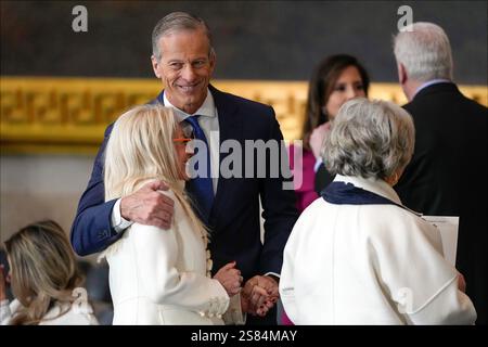 Senate Majority Leader John Thune (R-S.D.) stops to speak with ...