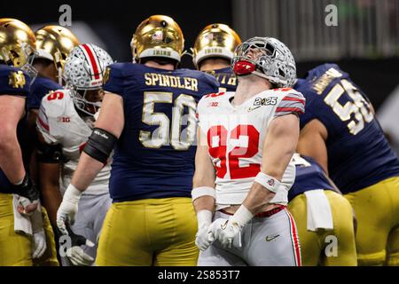 Ohio State defensive end Caden Curry (92) tackles Miami running back ...