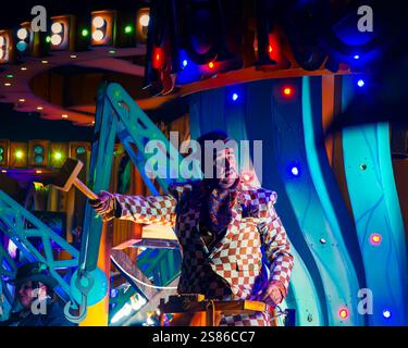 Glastonbury Carnival dancers on a float that is moving quickly creating ...