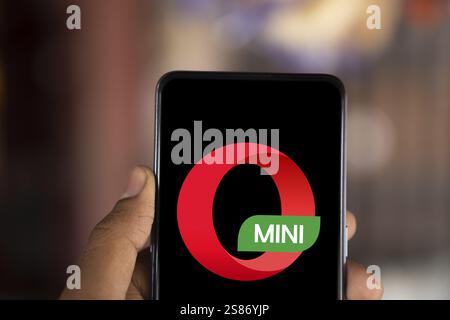 Opera mini logo is displayed on smartphone. Opera Mini is a mobile web ...