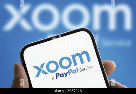 xoom logo is displayed on smartphone. Xoom Corporation is an electronic ...