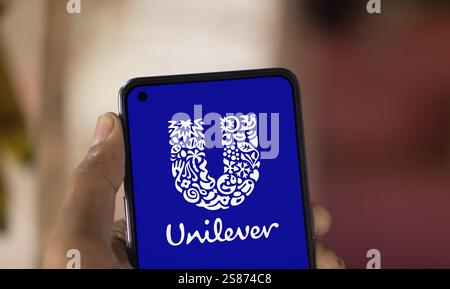 unilever logo is displayed on smartphone. Unilever PLC is a British ...