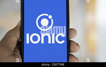 Ionic logo is displayed on smartphone. Ionic is an open-source UI ...