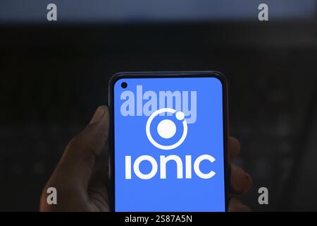 Ionic logo is displayed on smartphone. Ionic is an open-source UI ...