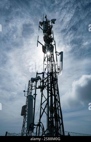 Radio mast in the back light lens flares high Stock Photo - Alamy