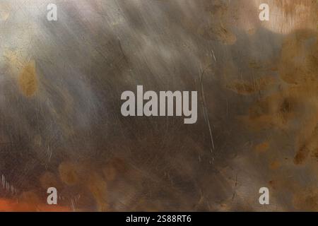 Aggressive rough copper background with reflections of orange and blue ...