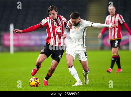 Sheffield United's Sydie Peck (left) and Derby County's Carlton Morris ...