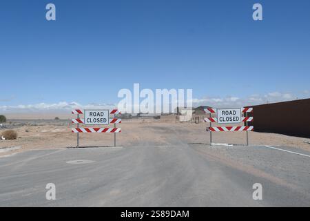 Road closed signs at the end of a desert road in Rio Rancho, New Mexico ...