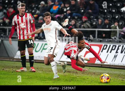 Sheffield United's Sam McCallum (right) is challenged by Swansea City's ...