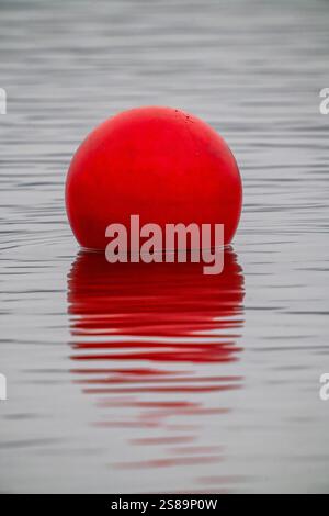 Target buoy on a lake, red marker buoys for water sports, regattas ...