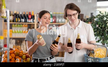 European youth girl choose and buy pizza with filling in store Stock ...