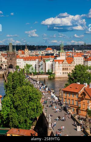 People cross the medieval Charles Bridge during a heavy snowfall in ...