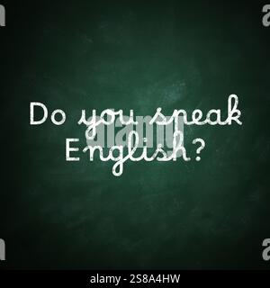 Do You Speak English? text on green chalkboard and stationery on desk ...