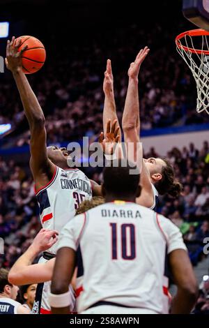UConn center Samson Johnson shoots over Florida guard Alijah Martin ...