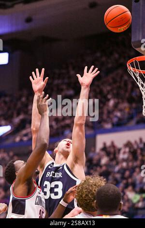UConn center Samson Johnson shoots over Florida guard Alijah Martin ...