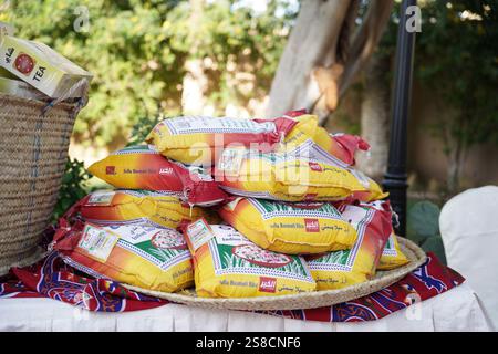 A vibrant stack of Sella Basmati Rice bags displayed outdoors. The ...
