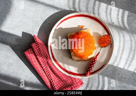 Sliced trout and red caviar served lemon Stock Photo - Alamy