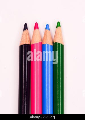 four color pencils on a white background Stock Photo - Alamy