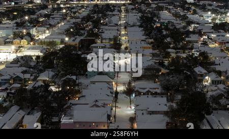 Aerial drone view of St. Claude Avenue in New Orleans blanketed in snow ...