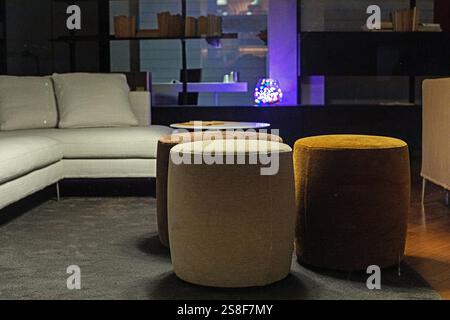 stylish soft tables poufs with furniture in a light interior Stock ...