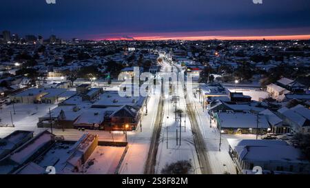 Aerial drone view of St. Claude Avenue in New Orleans blanketed in snow ...