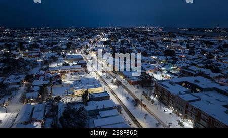 Aerial drone view of St. Claude Avenue in New Orleans blanketed in snow ...