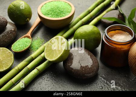 Spa composition with wet limes, sea salt, pebble stone and bamboo on ...