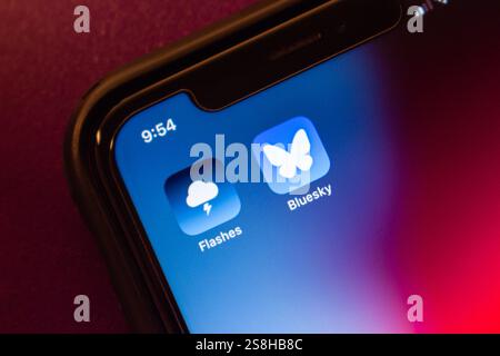 Flashes and Bluesky Social logos are shown on an iPhone. Flashes app is ...