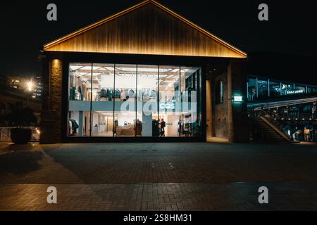 Modern Cos Storefront Display View at Night With Fashion Items and Sale ...