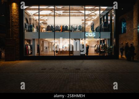 Modern Cos Storefront Display View at Night With Fashion Items and Sale ...