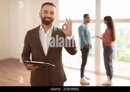 Real estate agent portrait with family getting new home. business ...