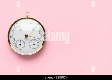 Aneroid barometer on pink background Stock Photo - Alamy