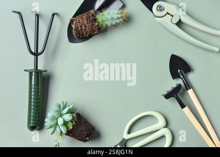 Frame made of different gardening tools and plant on green background ...