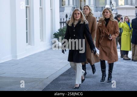 White House Press Secretary Karoline Leavitt walks with aides as she ...