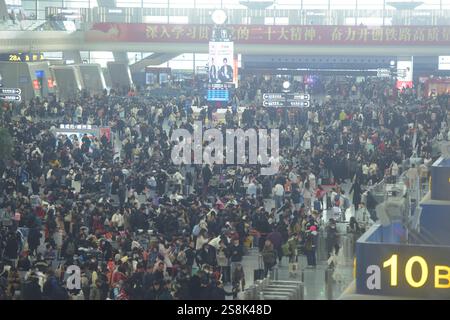 Passengers wait for trains at Hangzhoudong railway station in Hangzhou ...