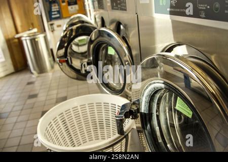 Washing machines seen inside self service laundry. (Photo by Kristian ...