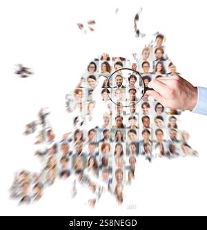 Hand with magnifying glass searches for suitable applications among ...