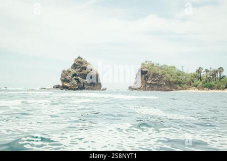 Beautiful rocks on Tanjung Papuma beach, Jember, Indonesia Stock Photo ...